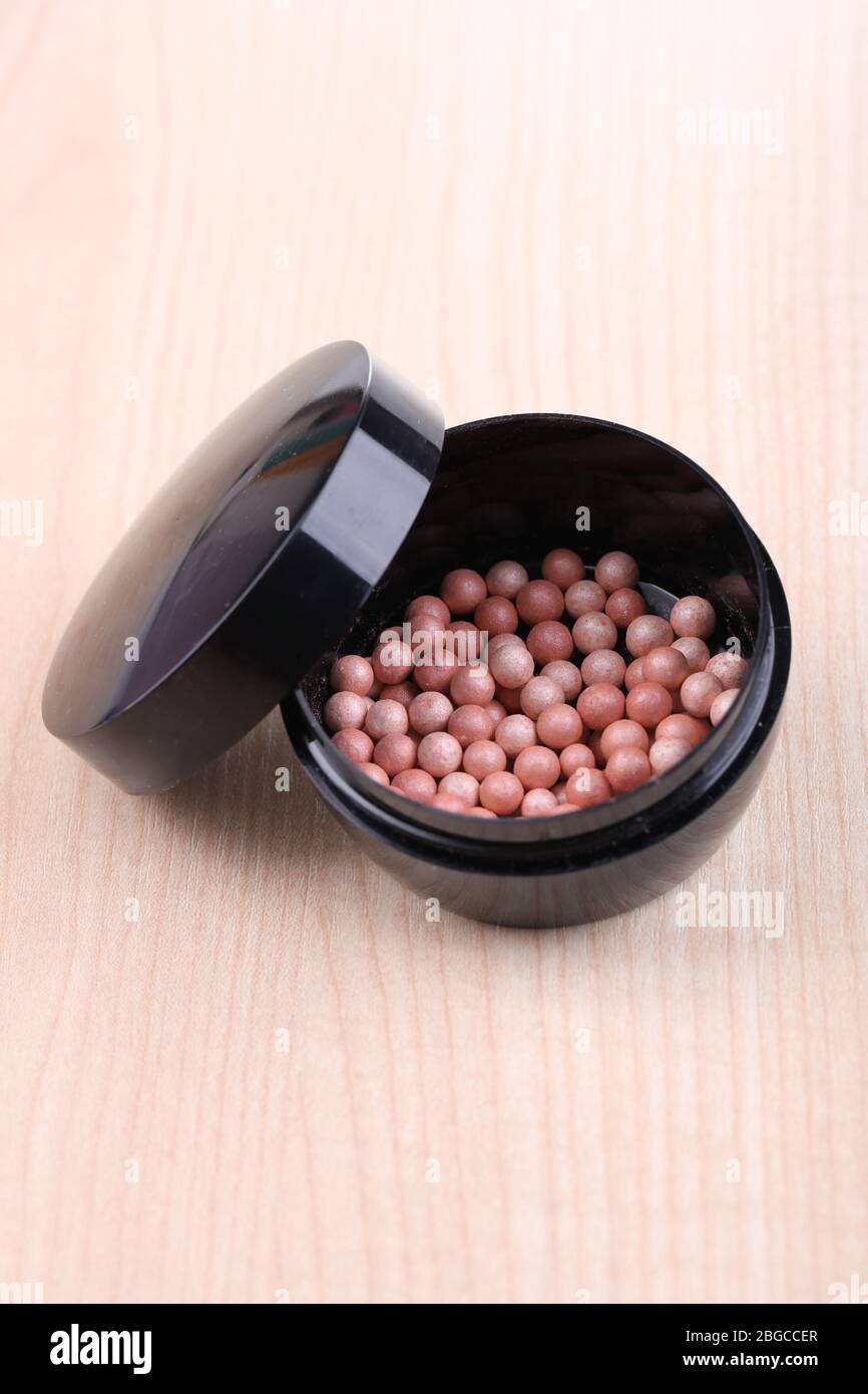 Powder balls on wooden background Stock Photo - Alamy