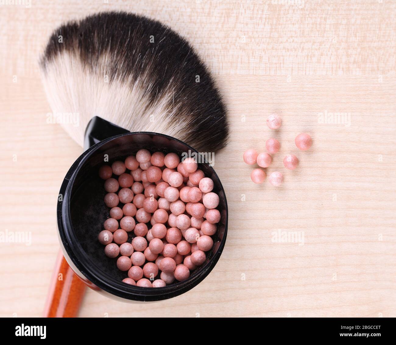 Powder balls on wooden background Stock Photo - Alamy