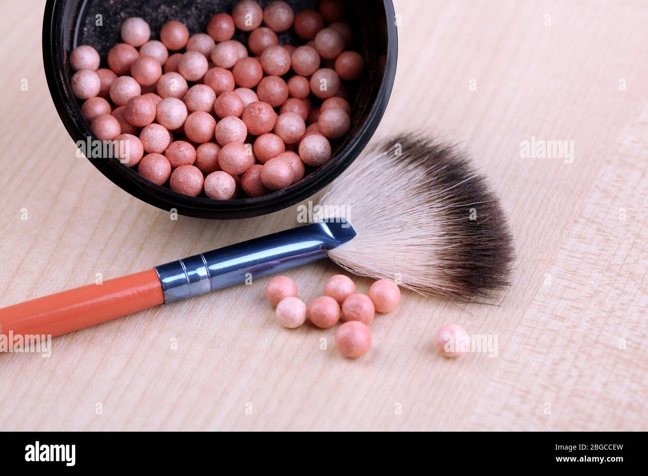 Powder balls on wooden background Stock Photo - Alamy