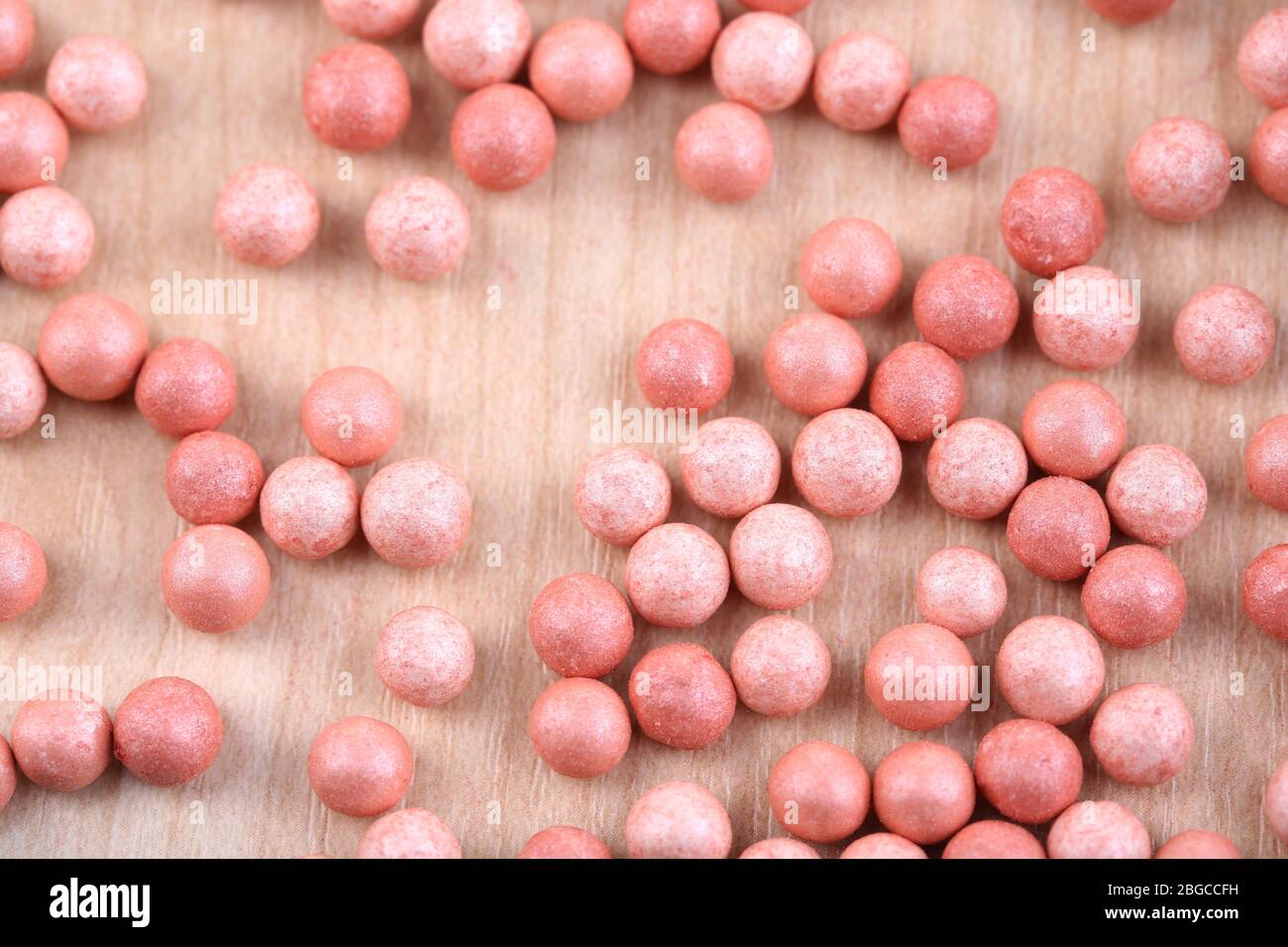 Powder balls on wooden background Stock Photo - Alamy