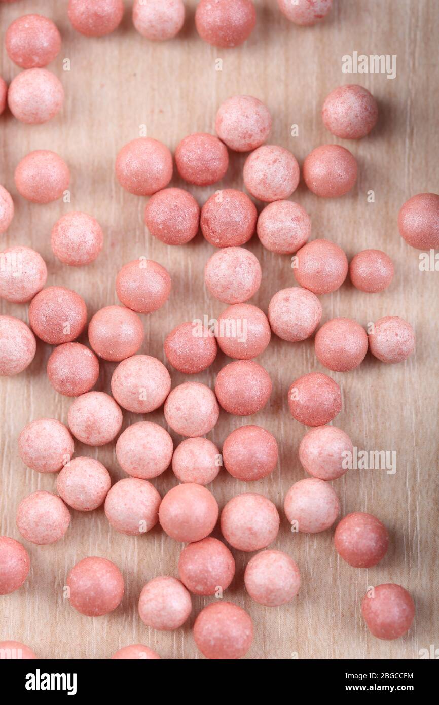 Powder balls on wooden background Stock Photo - Alamy