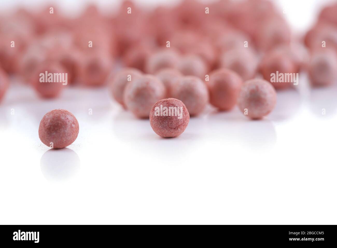 Powder balls isolated on white Stock Photo - Alamy