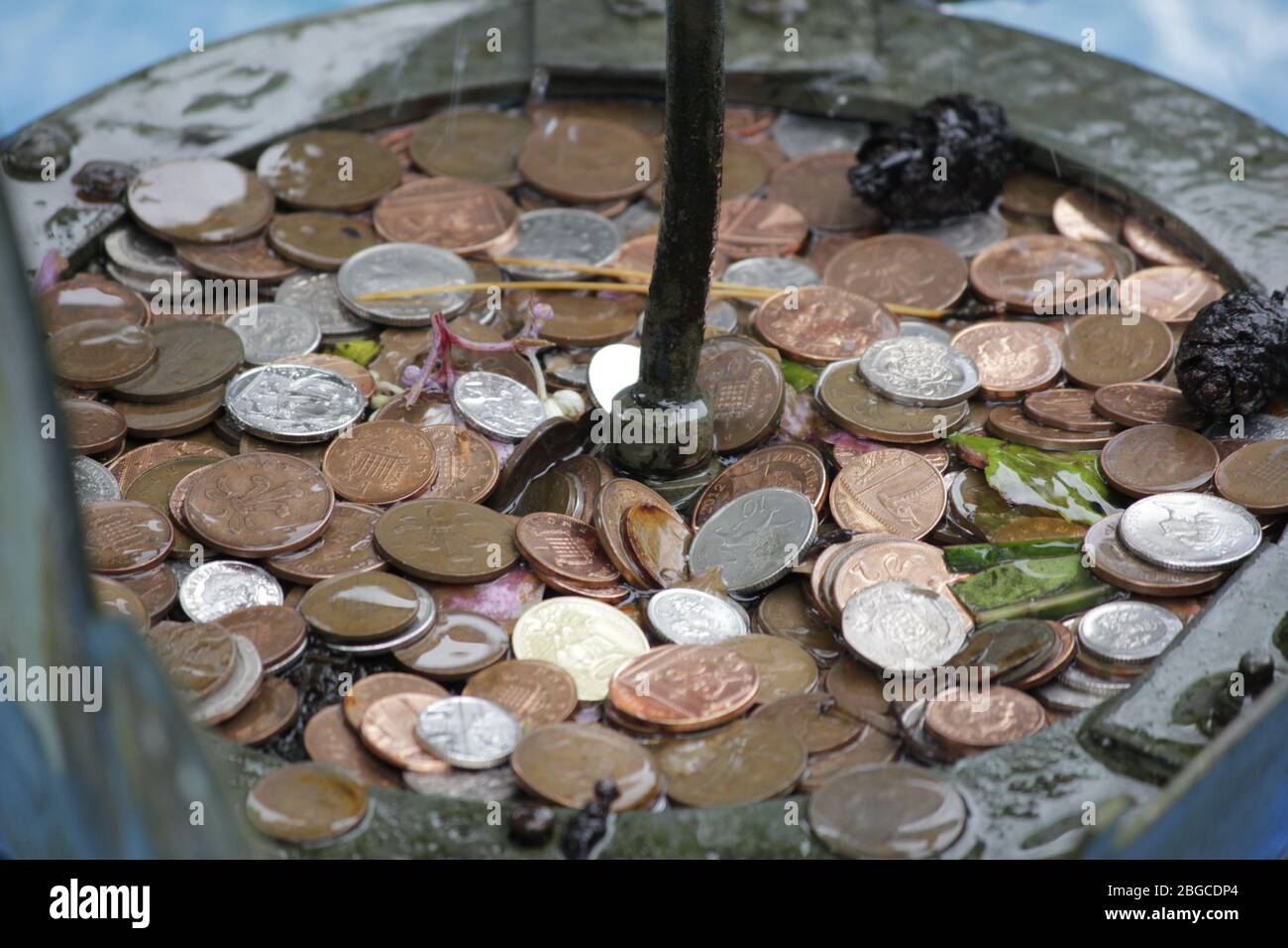 british coins in water fountain Stock Photo - Alamy