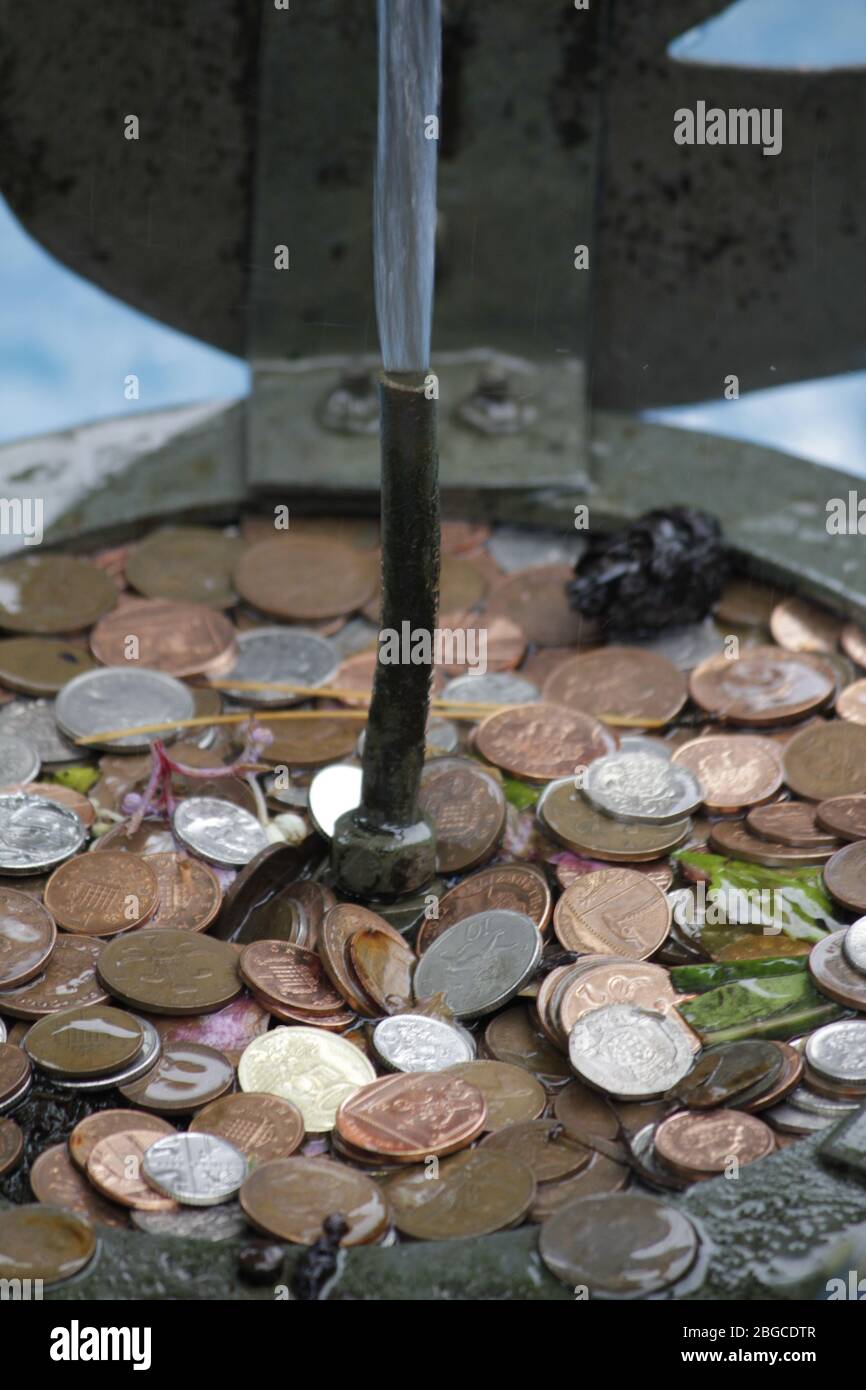 british coins in water fountain Stock Photo - Alamy