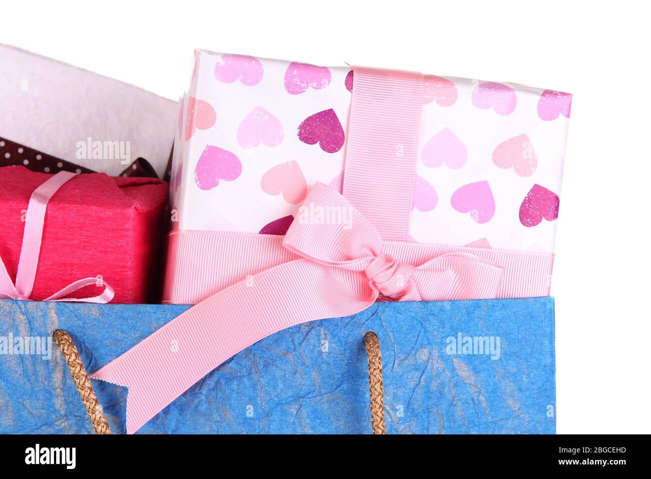 Presents in paper bag isolated on white Stock Photo - Alamy