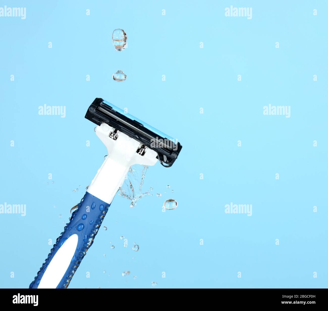 Men shaver on light blue background Stock Photo - Alamy