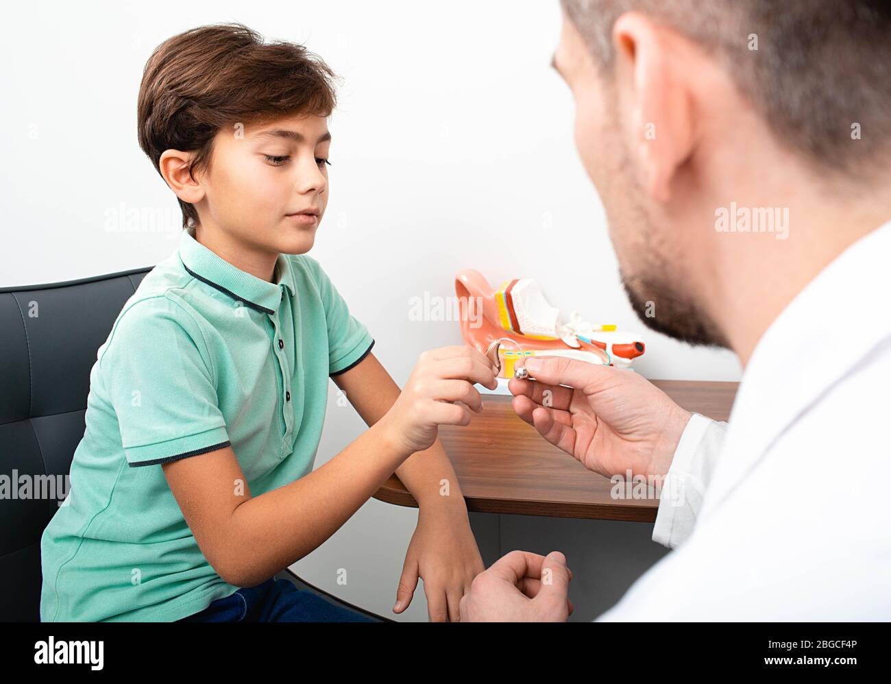 Boy hearing aid hi-res stock photography and images - Alamy