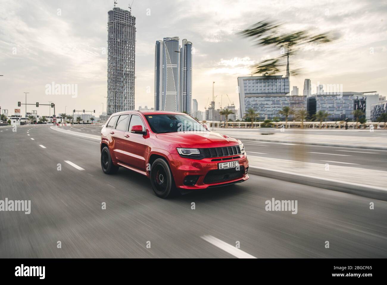 Red sport car extreme motion through megapolis buildings Stock Photo ...