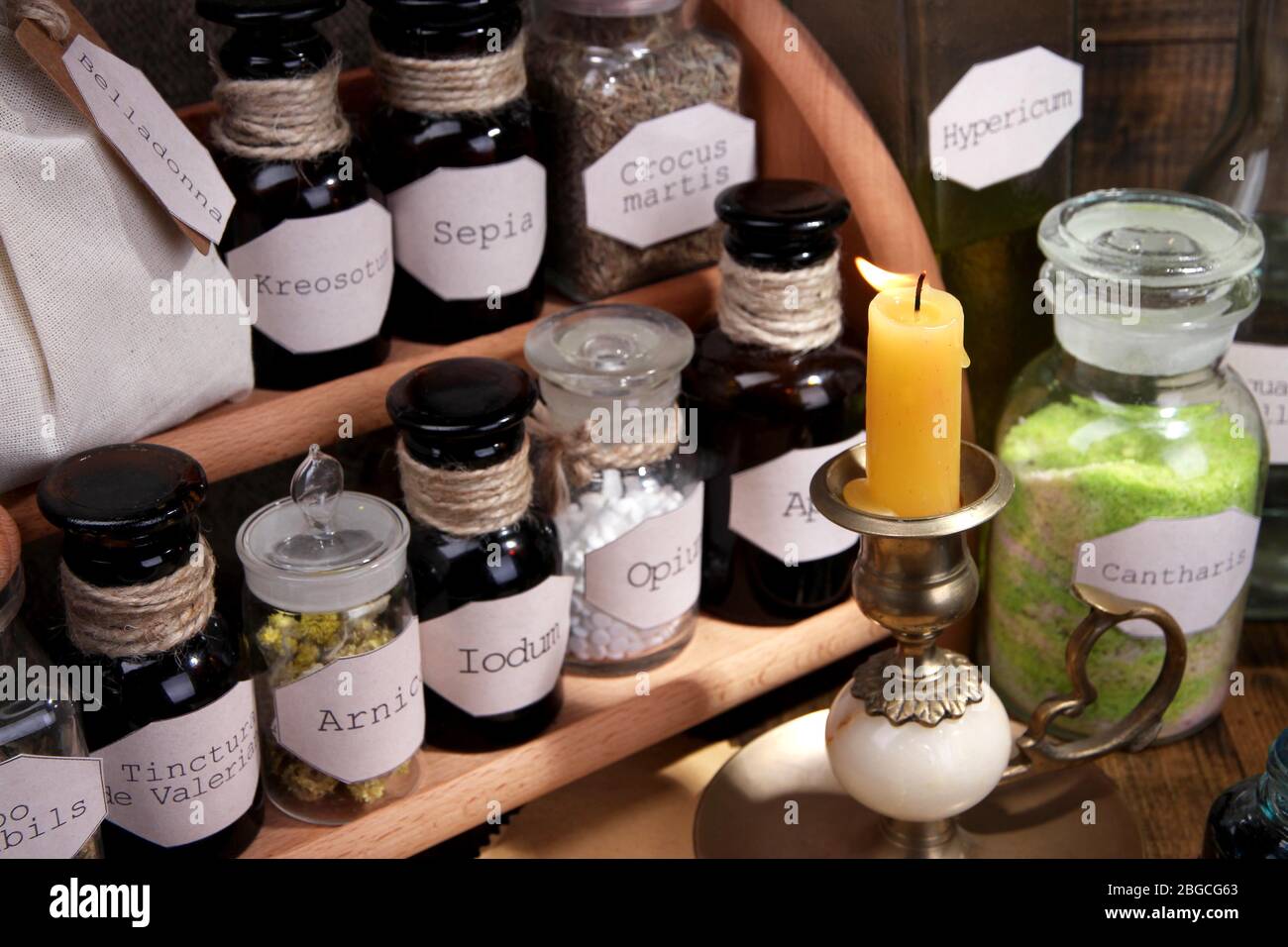 Composition with empty page, candle, mortar and historic old pharmacy ...