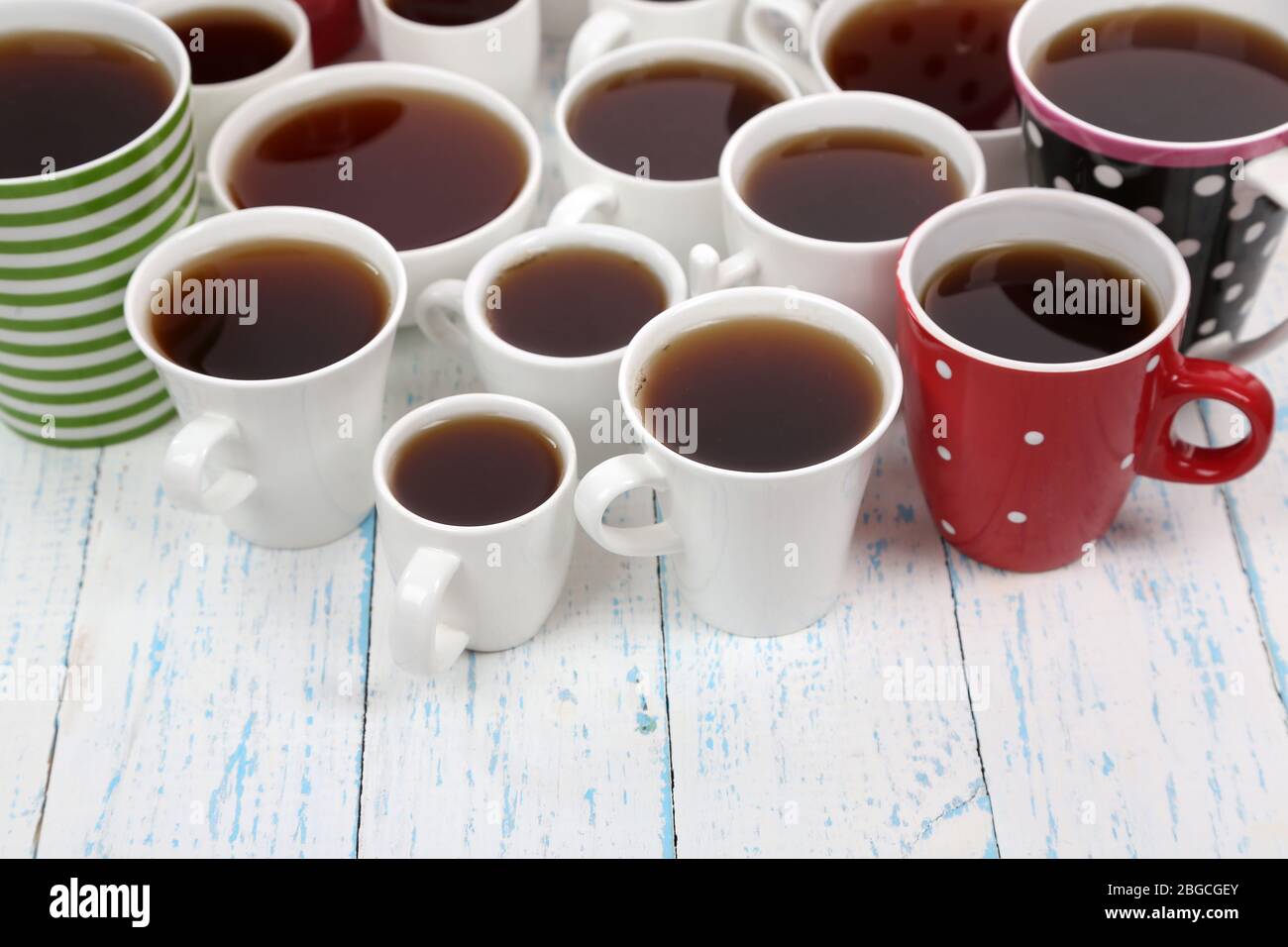 Many cups of tea on table close-up Stock Photo - Alamy
