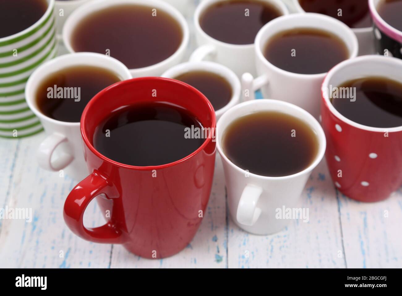 Many cups of tea on table close-up Stock Photo - Alamy