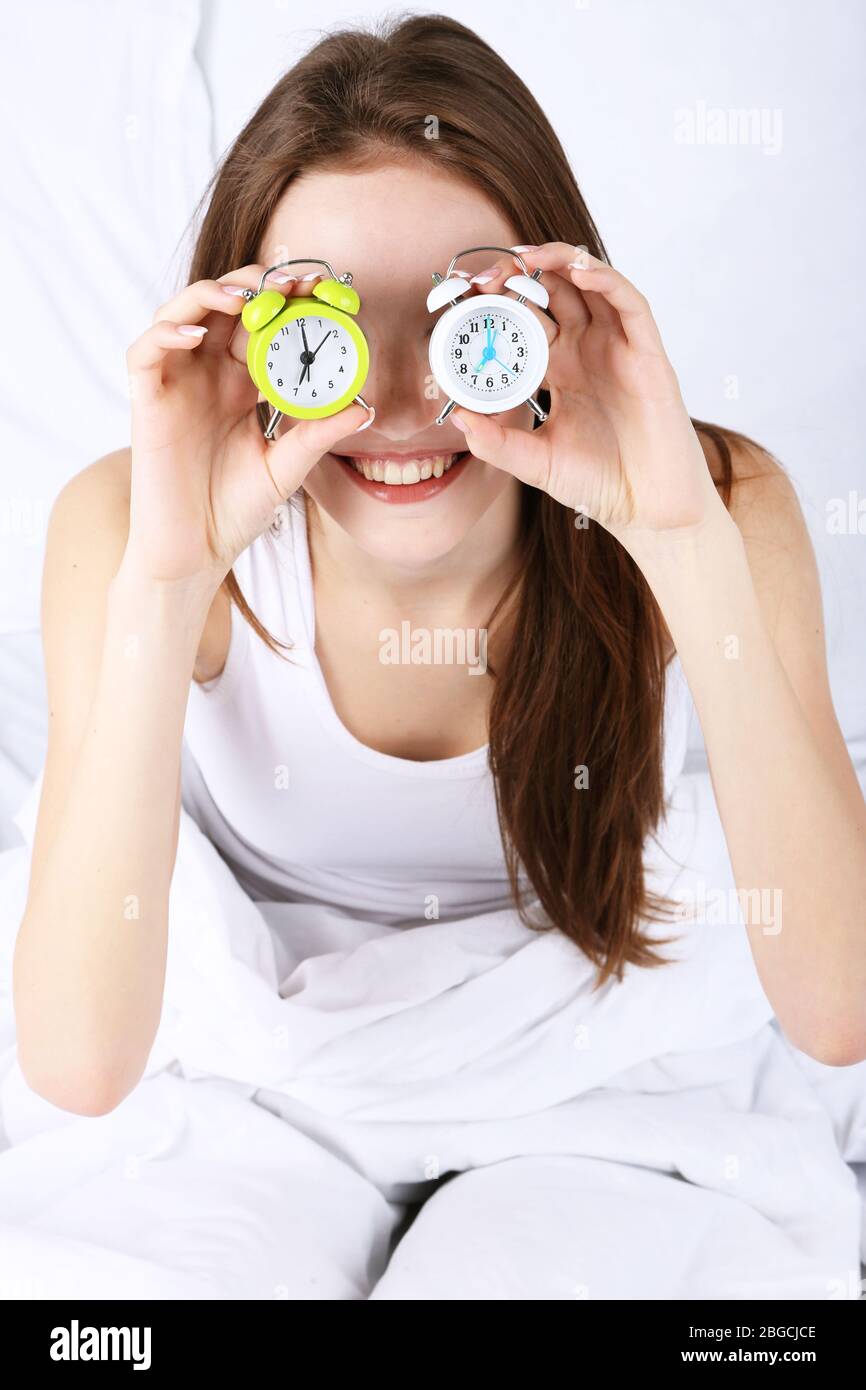 Woman alarm clocks bed hi-res stock photography and images - Alamy