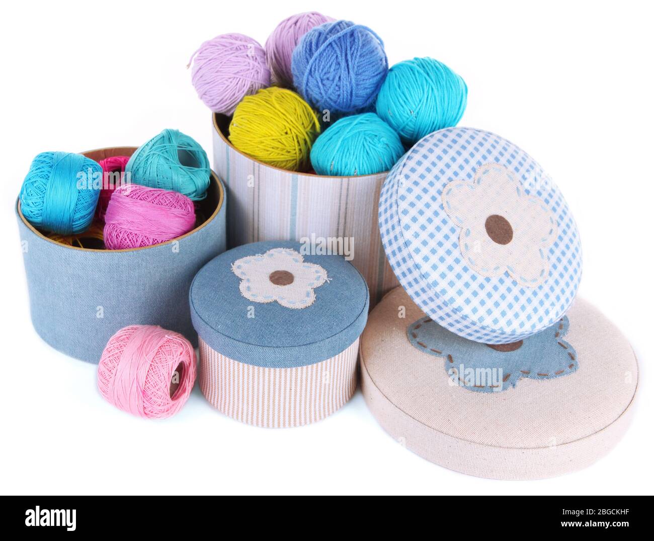 Decorative boxes with colorful skeins of thread isolated on white Stock ...