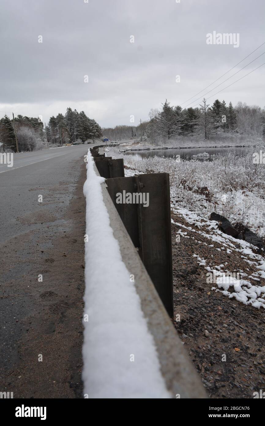 Snow and highway perspective with guard rail steel guard hi-res stock ...