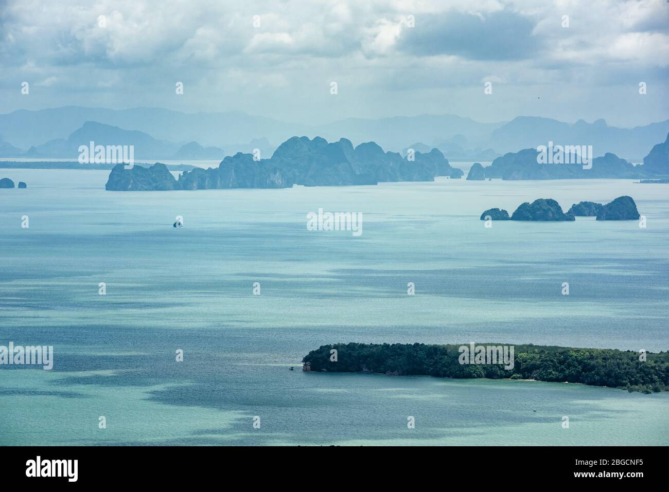 forest and sea view from rough and rocky mountain top Stock Photo - Alamy