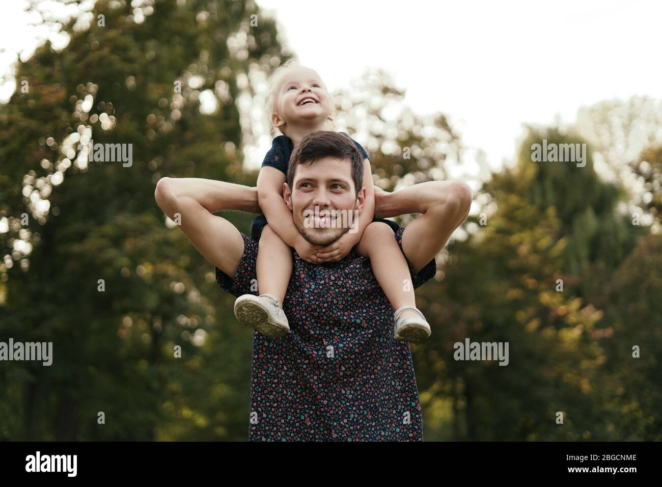Happy dad and child spending time outdoors. Father daughter moments ...