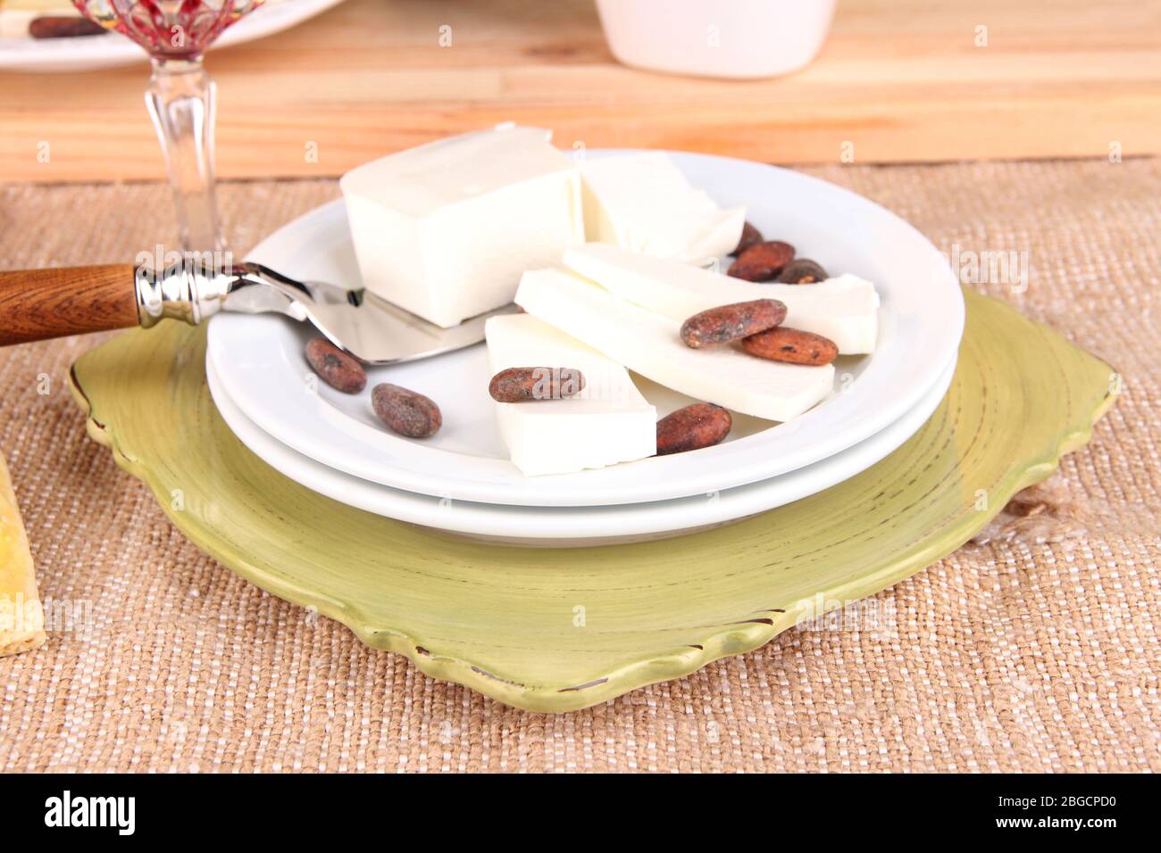 Assorted cheese plate on table background Stock Photo - Alamy