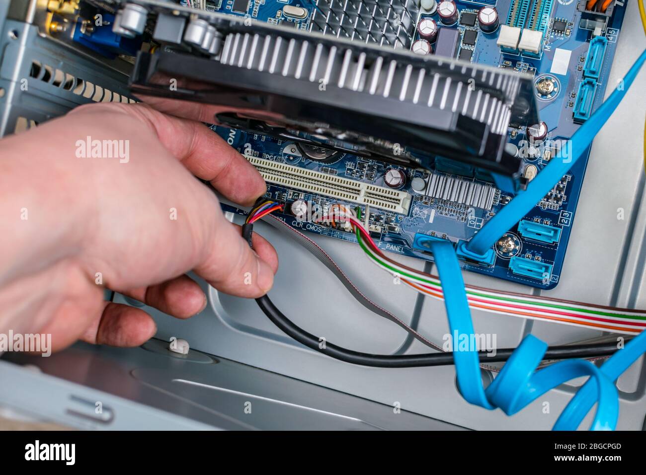 The computer master connects all the necessary wires to the motherboard ...