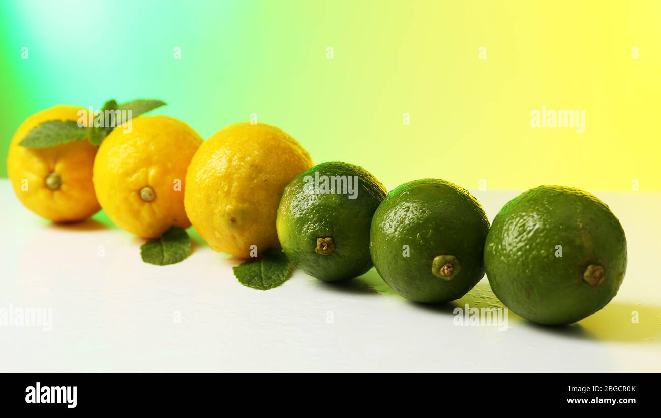 Lemons and limes on bright background Stock Photo - Alamy