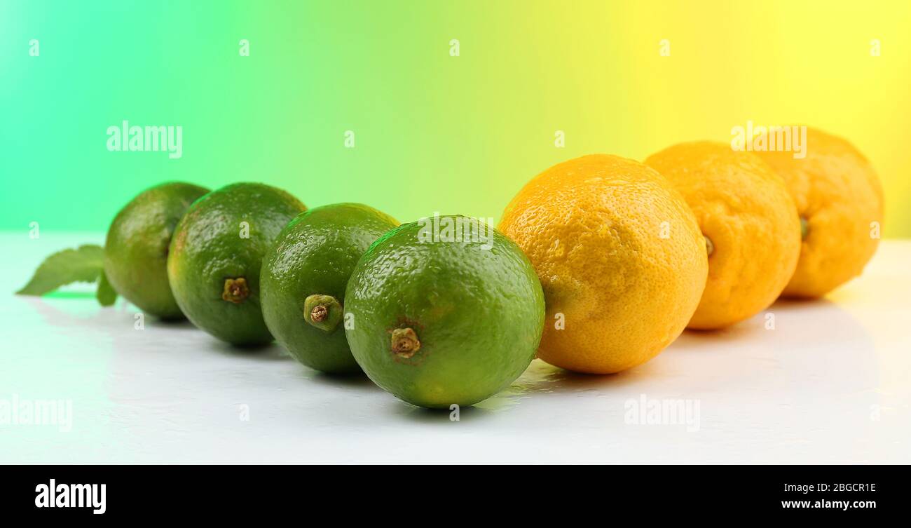 Lemons and limes on bright background Stock Photo - Alamy