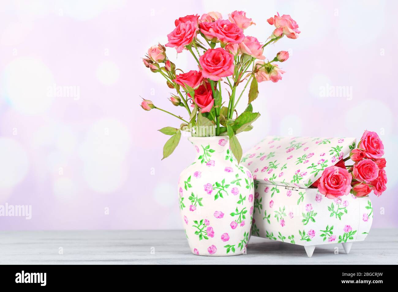 Beautiful small pink roses, on light background Stock Photo - Alamy