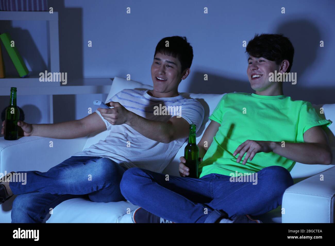 Two friends watching football at home of blacking-out Stock Photo - Alamy