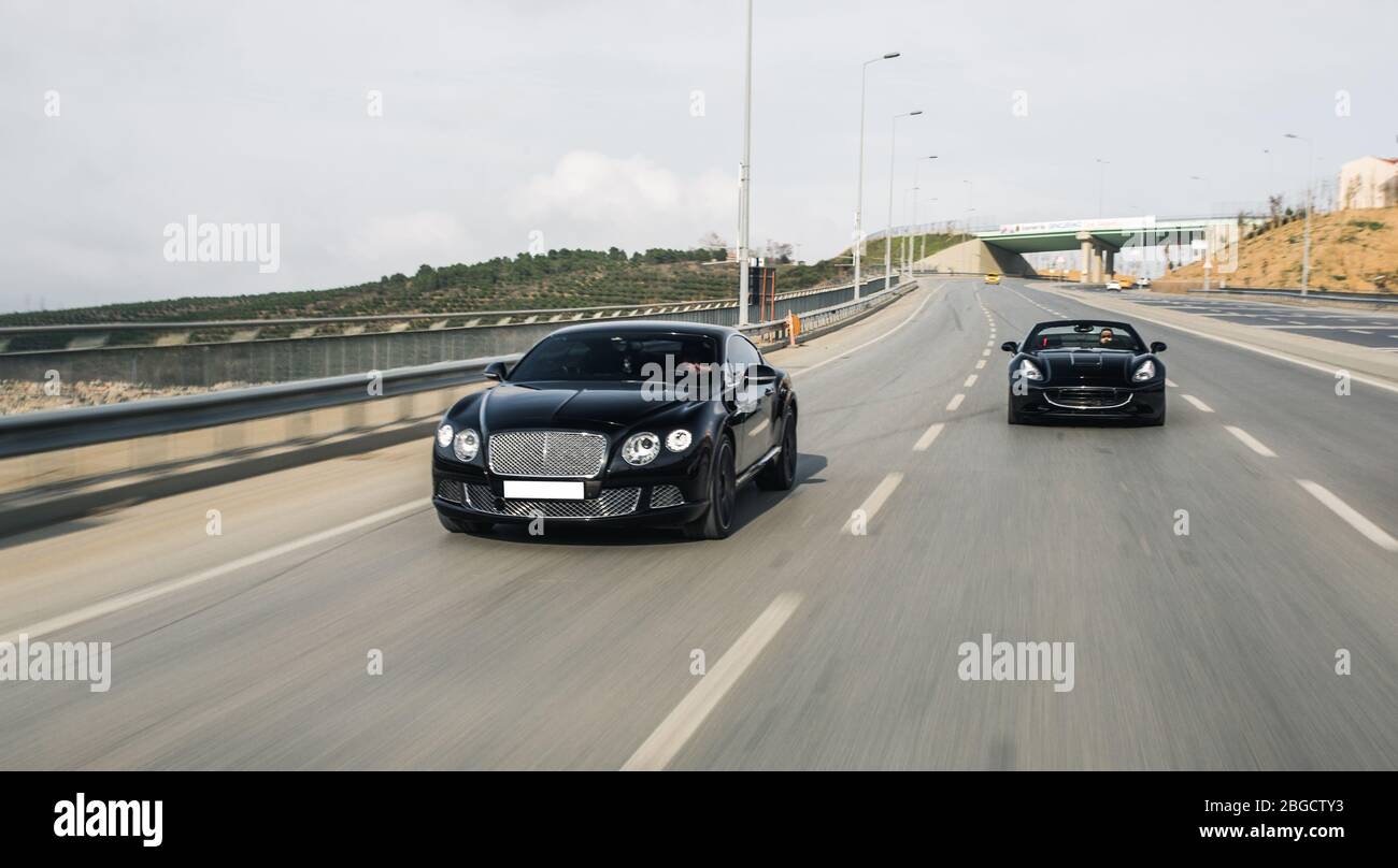 Black model car speed race on countryside,chase on highway Stock Photo ...