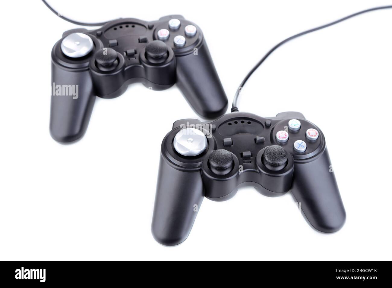 Black game controllers isolated on white Stock Photo - Alamy