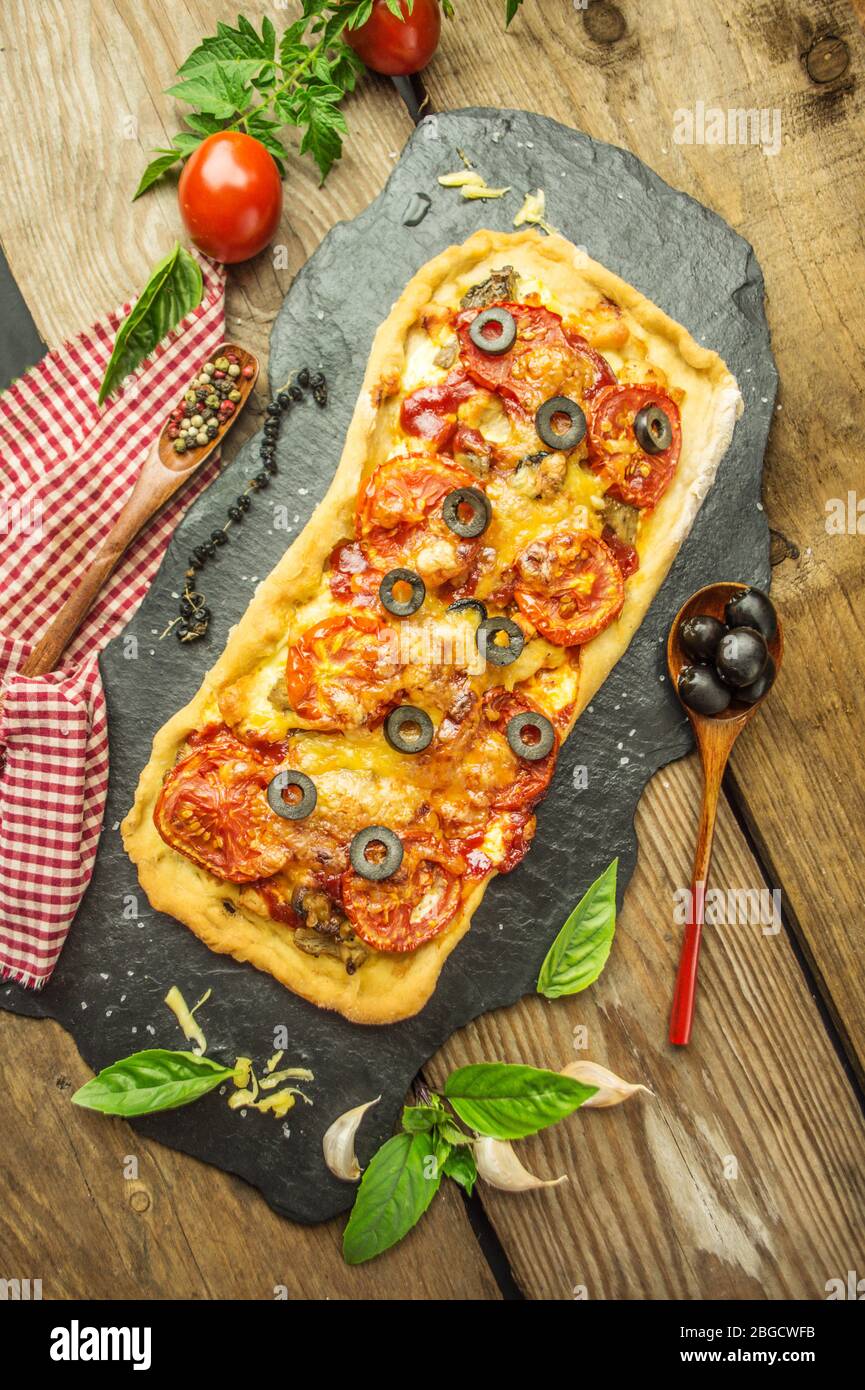 Close up view of baked homemade piza. Rustic pizza home made food ...