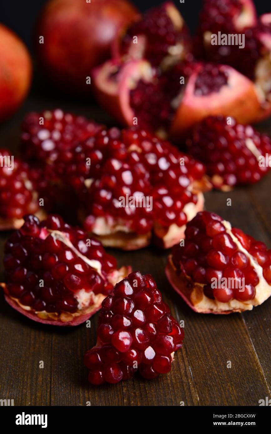 Ripe pomegranates on table close-up Stock Photo - Alamy