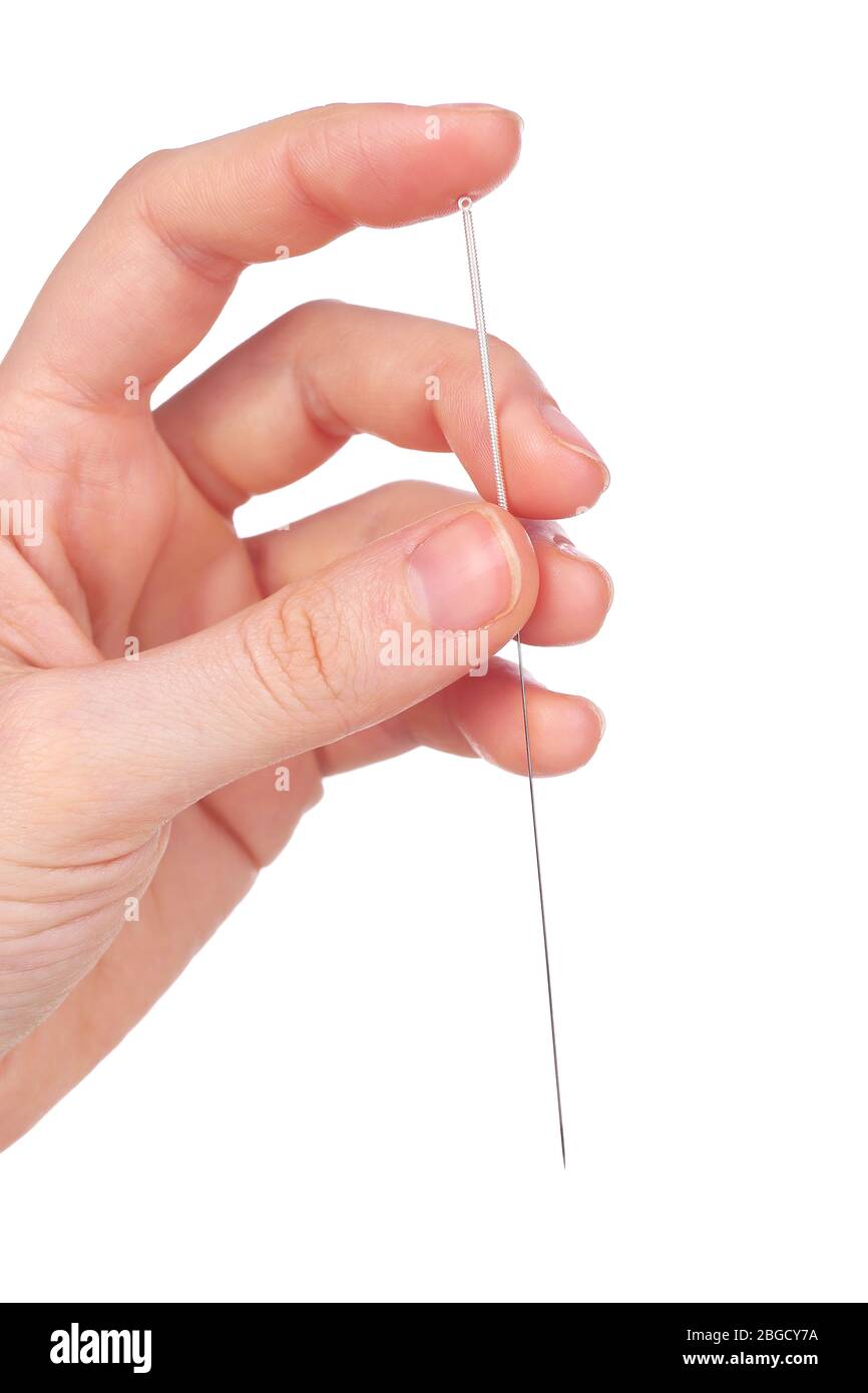 Hand holding needle for acupuncture on hand, close up. Isolated on ...