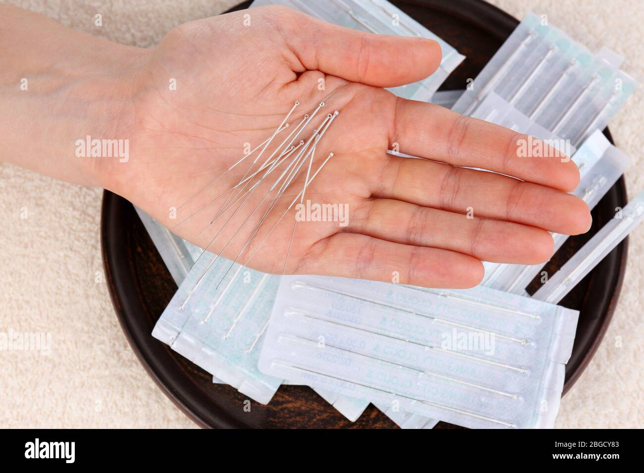 Needles for acupuncture on hand, close up Stock Photo - Alamy