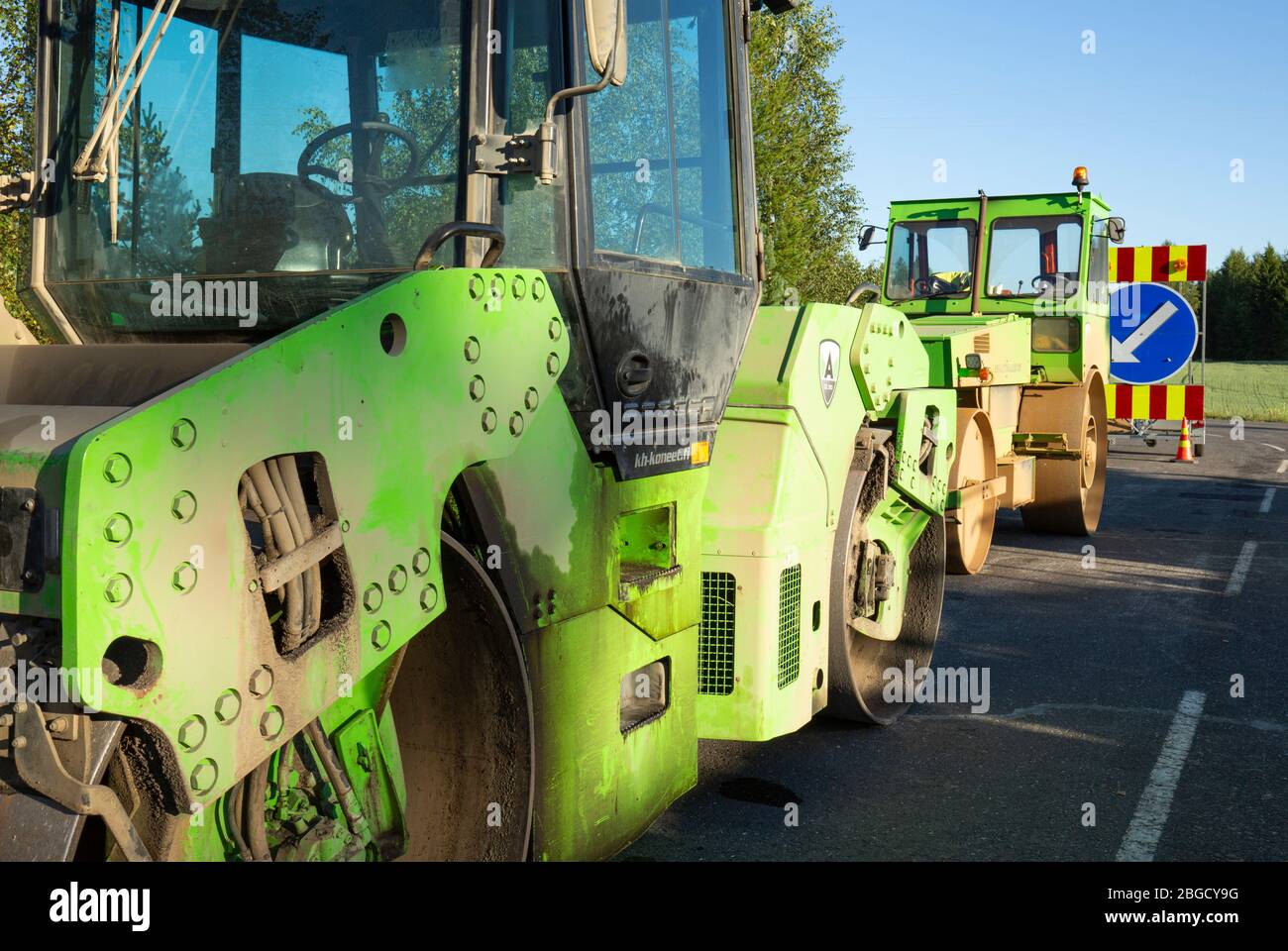 Big green road rollers used in tarmac laying , Finland Stock Photo - Alamy