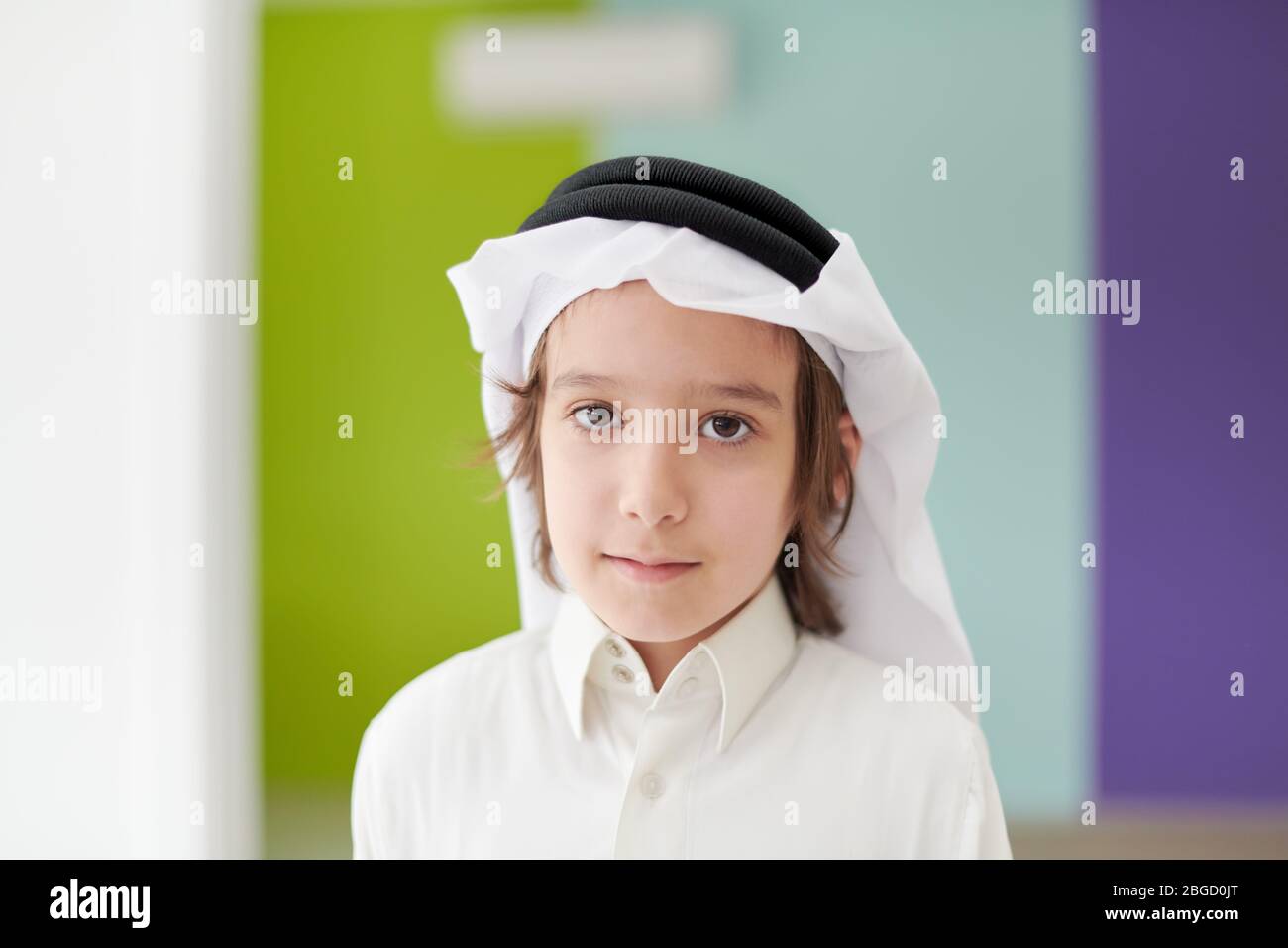 portrait of little arabian boy in traditional clothes during Ramadan ...