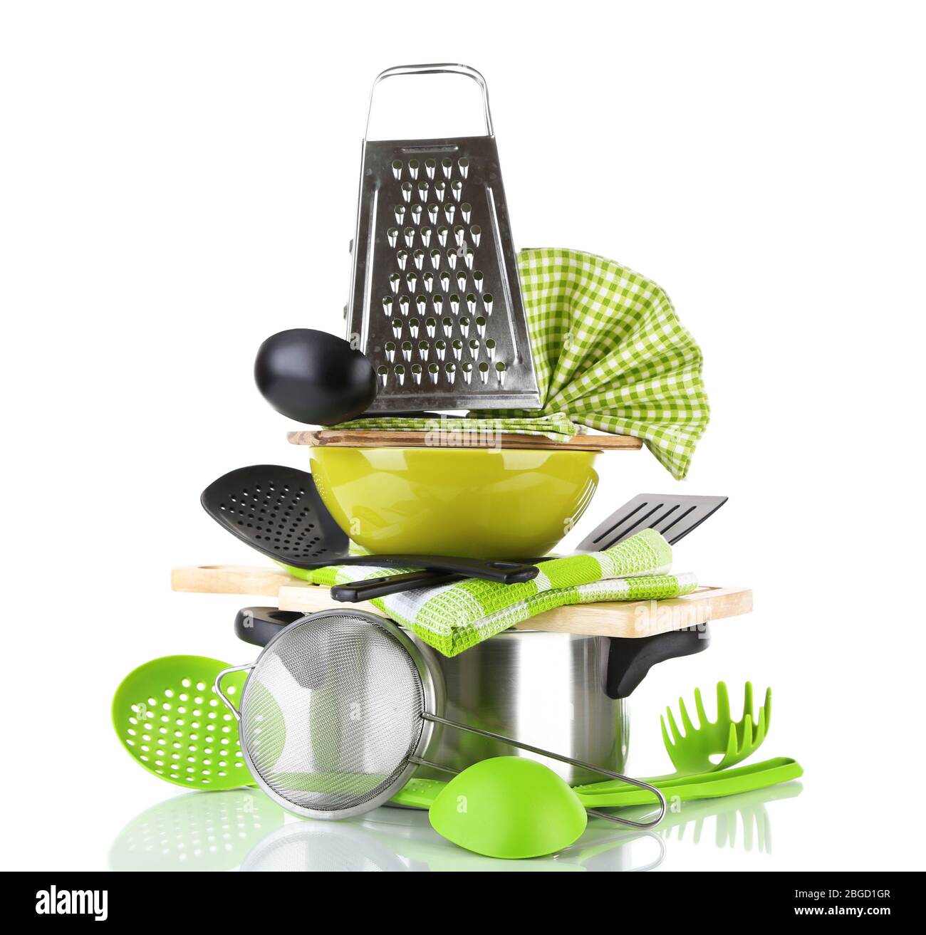 Stacked cooking equipment isolated on white Stock Photo - Alamy