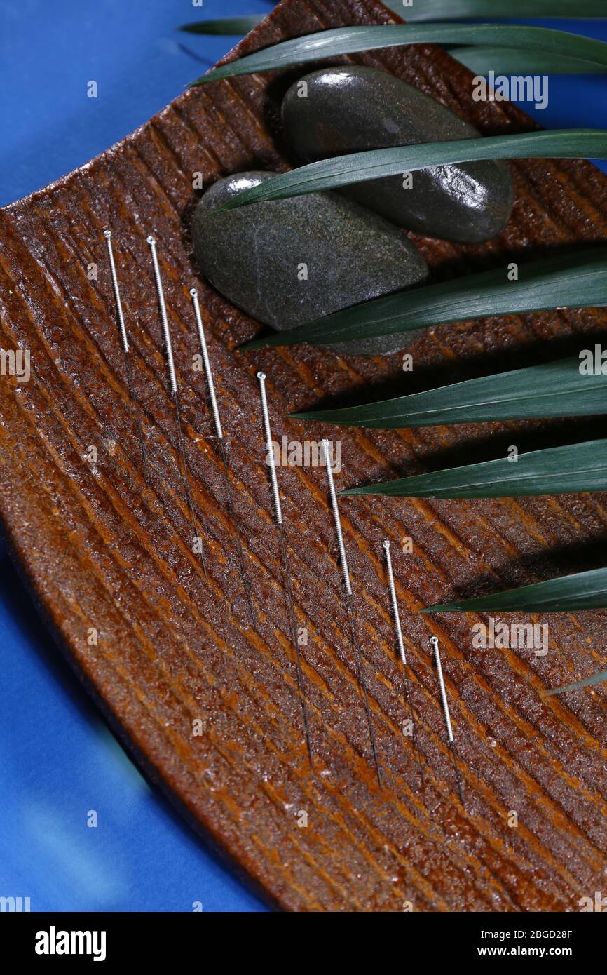 Acupuncture needle on black stone hi-res stock photography and images ...