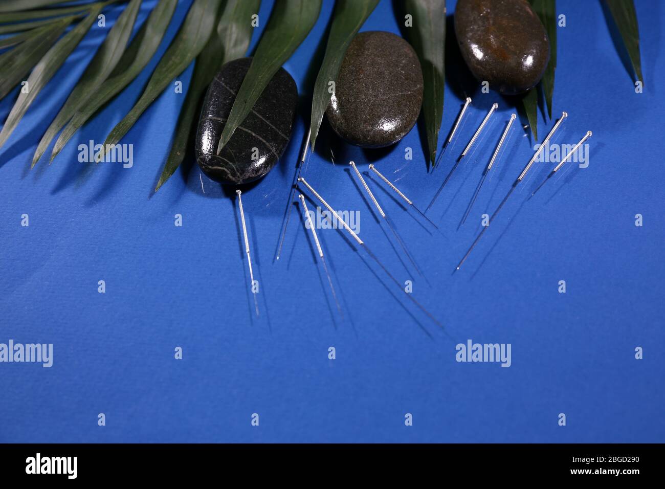 Acupuncture needle on black stone hi-res stock photography and images ...