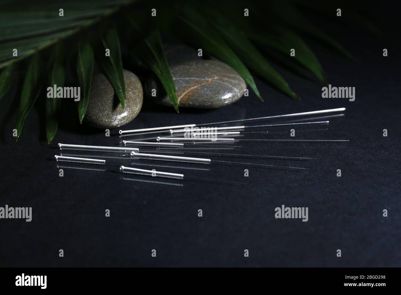Acupuncture needle on black stone hi-res stock photography and images ...