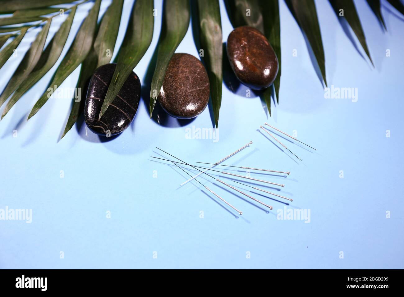 Acupuncture needle on black stone hi-res stock photography and images ...