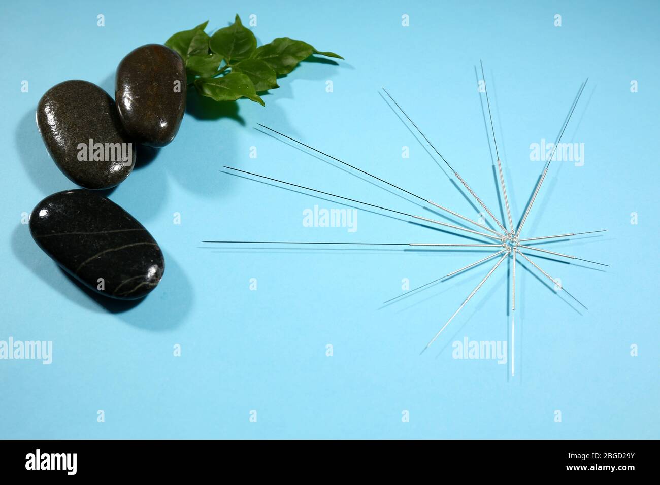 Acupuncture needle on black stone hi-res stock photography and images ...