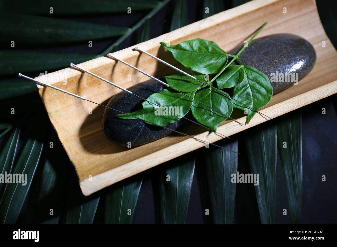 Acupuncture needle on black stone hi-res stock photography and images ...