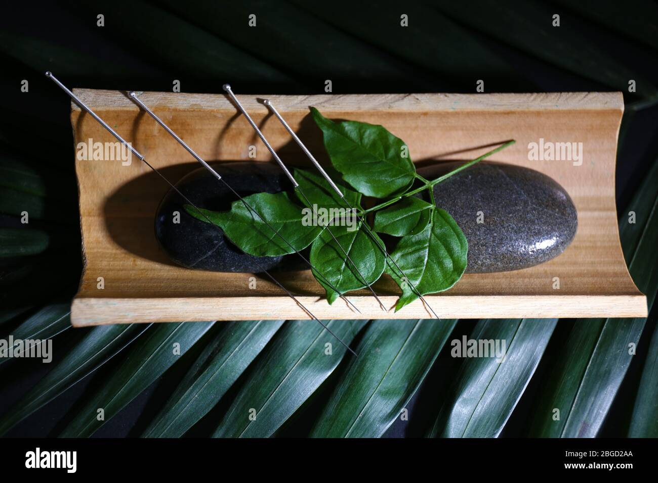Acupuncture needle on black stone hi-res stock photography and images ...
