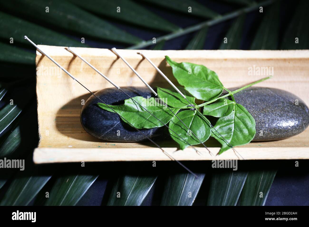 Acupuncture needle on black stone hi-res stock photography and images ...