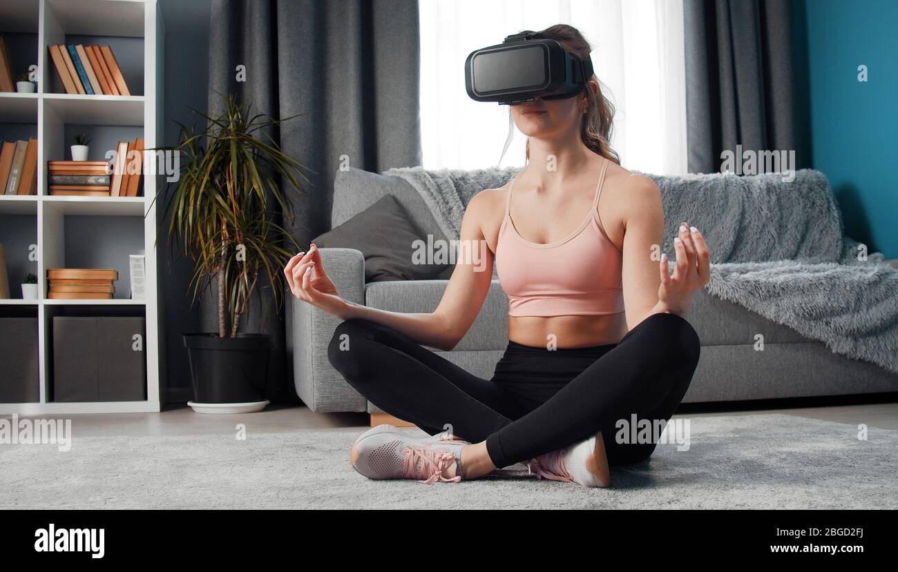 Female using AR while meditating Stock Photo - Alamy