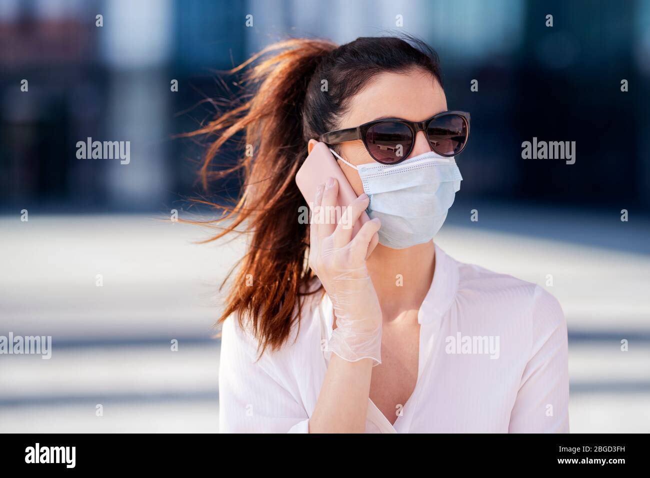 Close-up shot of confident woman wearing face mask and talking with ...