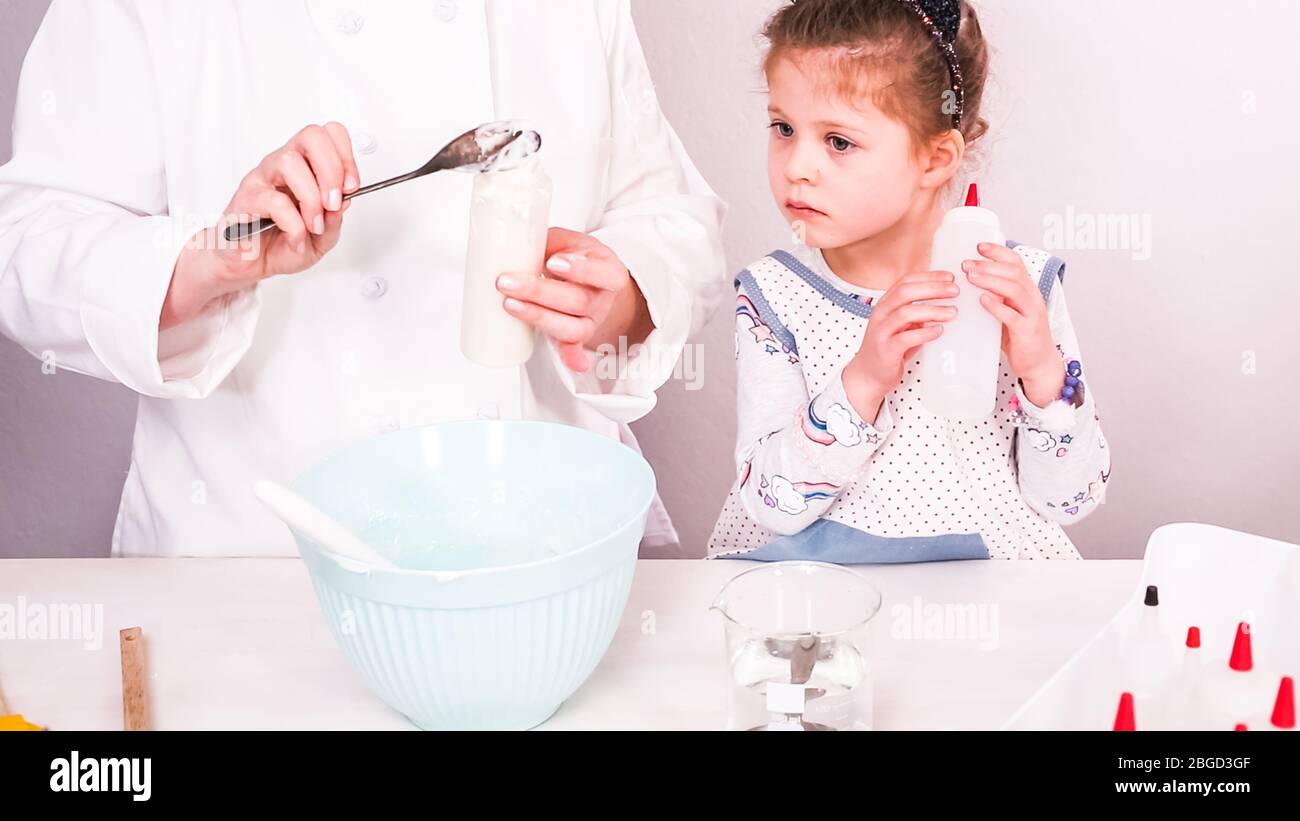 Step by step. Mixing royal icing to decorate sugar cookies Stock Photo ...