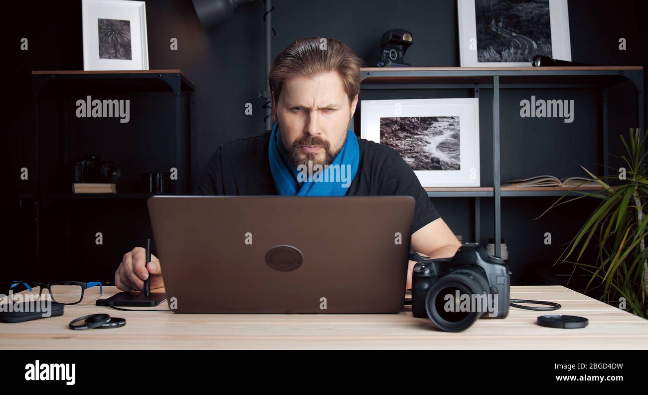 Photographer processing images Stock Photo - Alamy