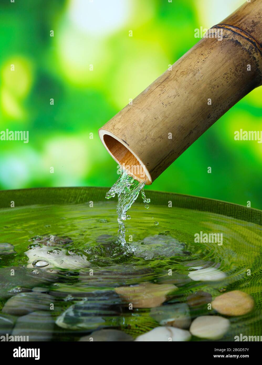 Spa still life with bamboo fountain, on bright background Stock Photo ...