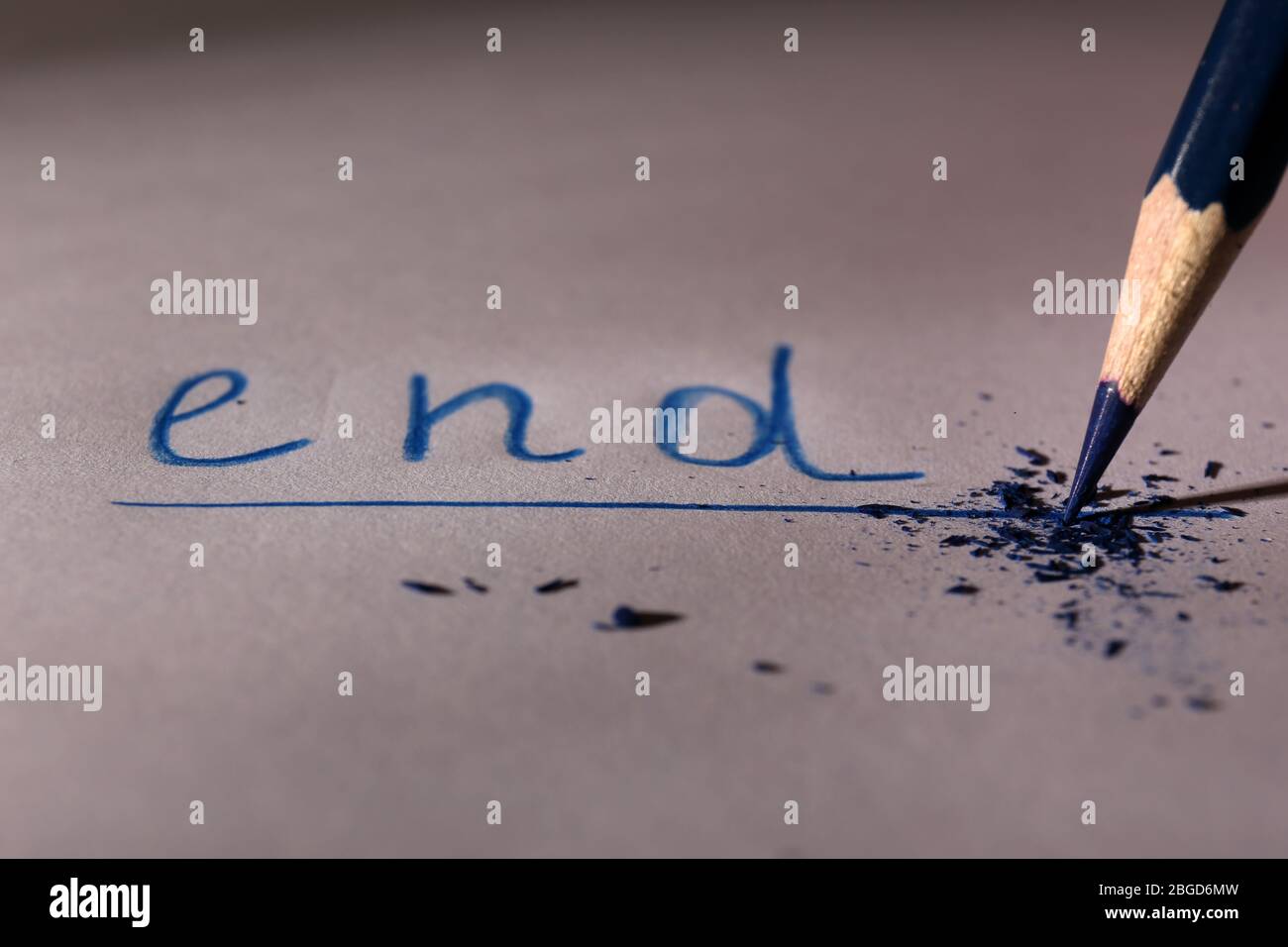 Word End and breaking pencil on paper, close up Stock Photo - Alamy