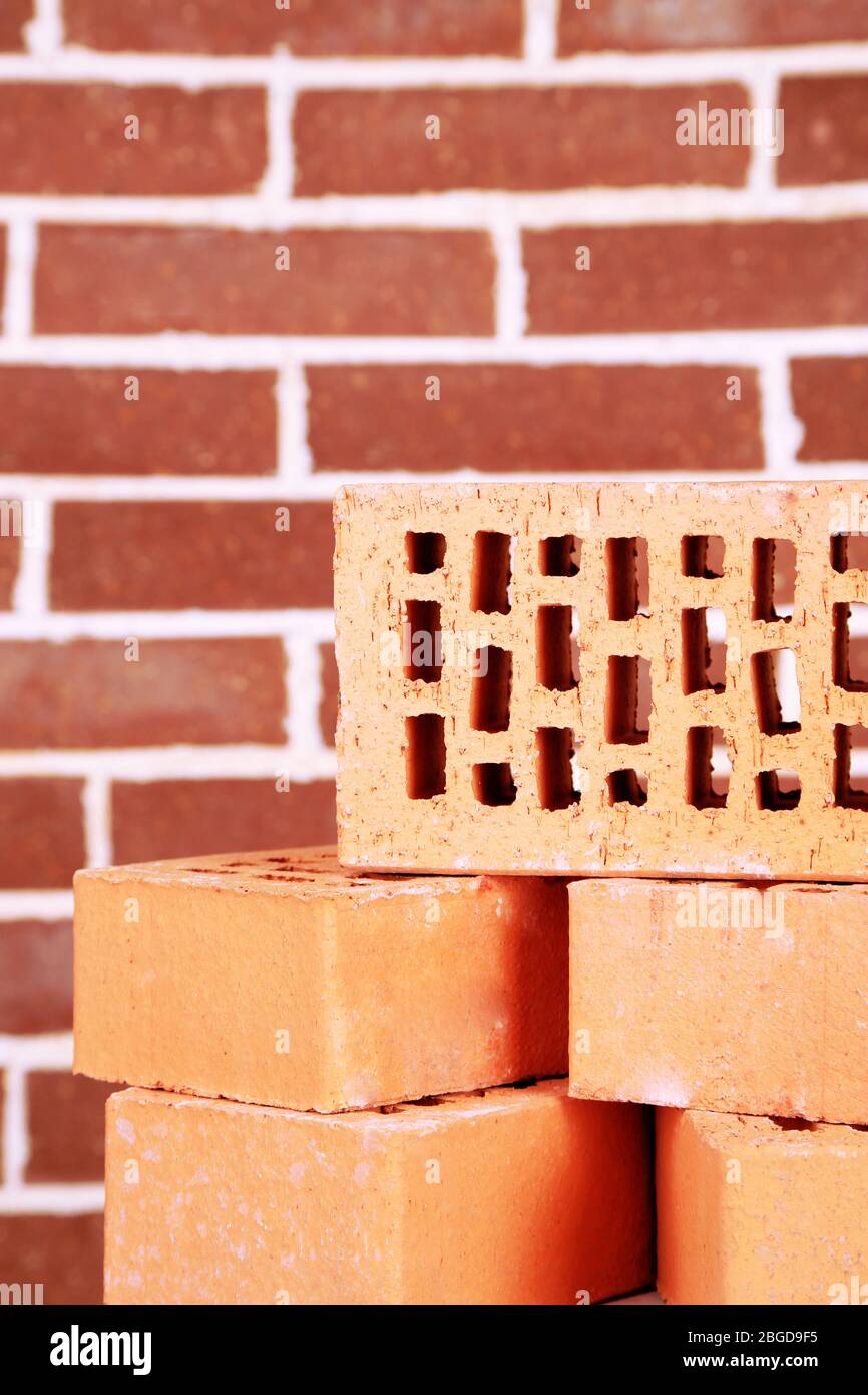 New bricks on brick wall background Stock Photo - Alamy